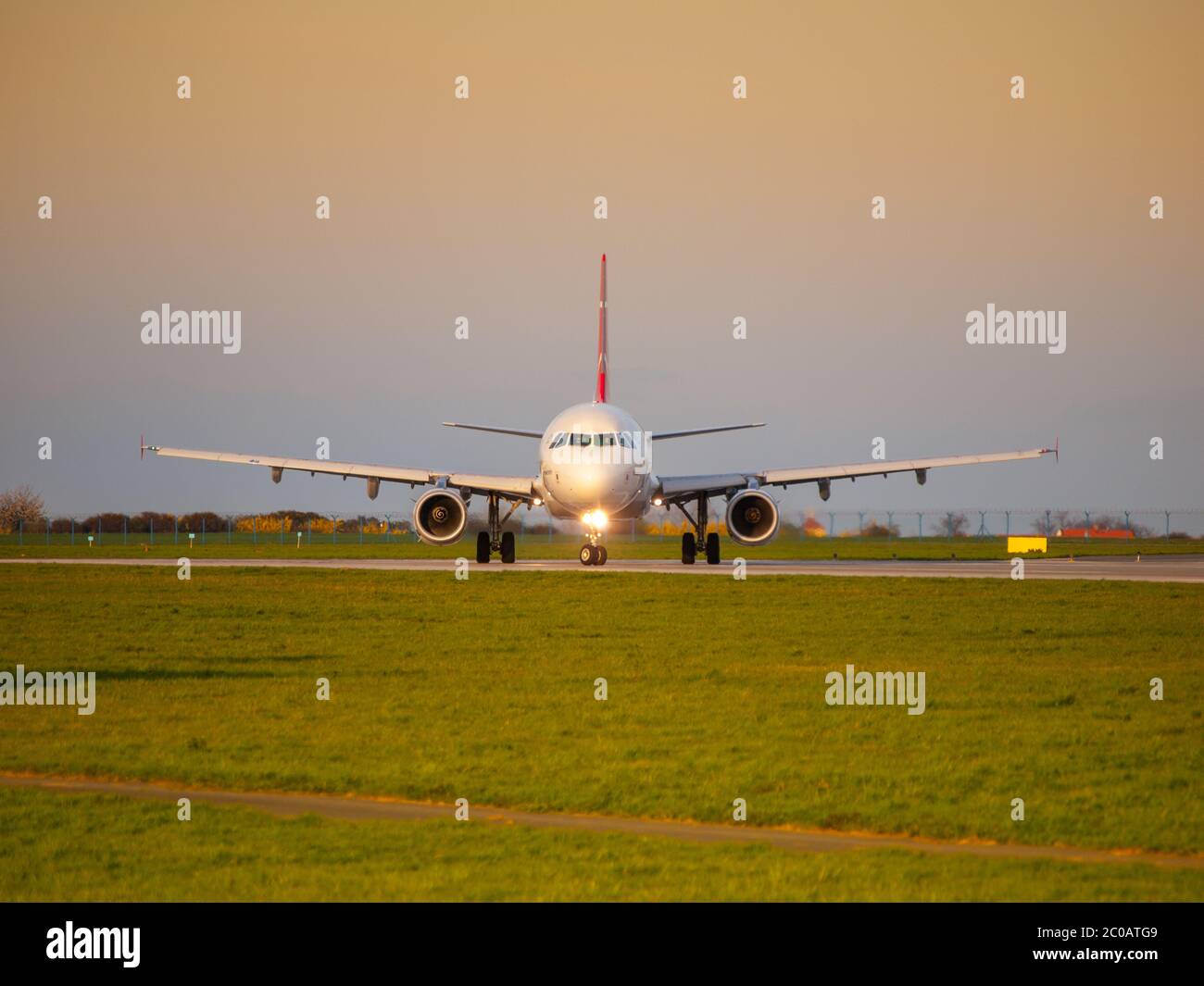 Plane with on the airport runway, front view Stock Photo - Alamy