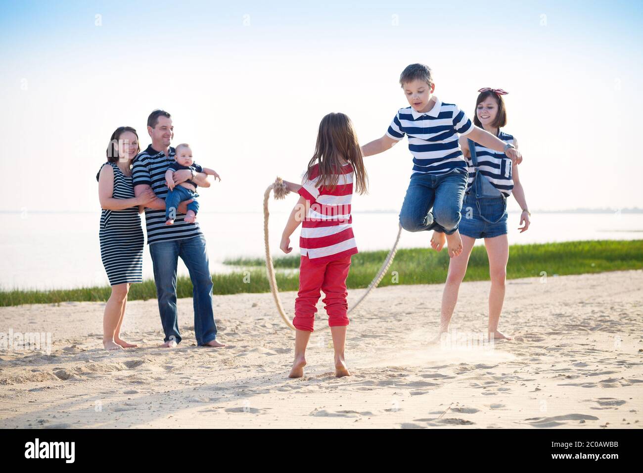 Family tug war beach hi-res stock photography and images - Alamy