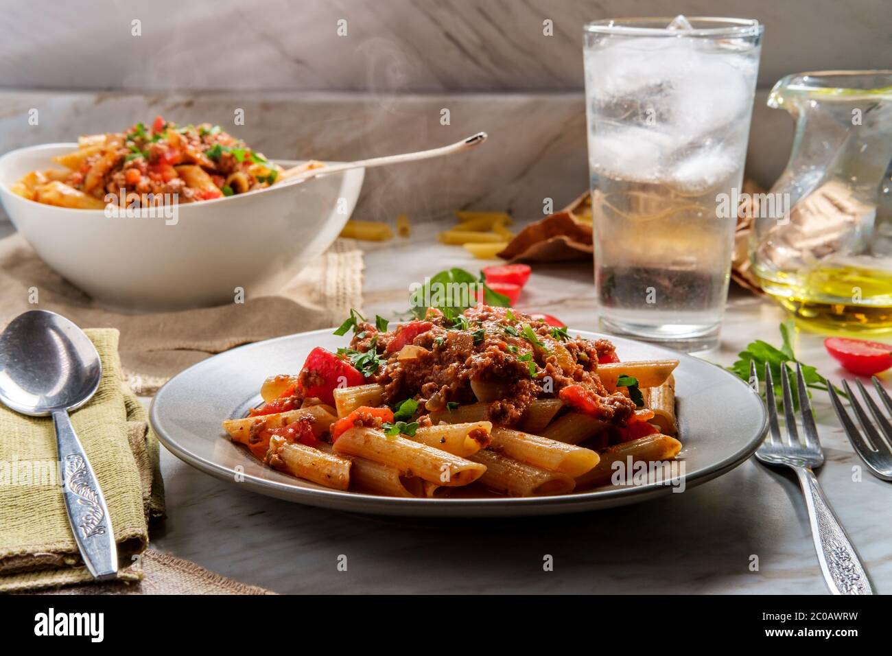 Authentic Italian dinner penne ragu alla bolognese Stock Photo - Alamy