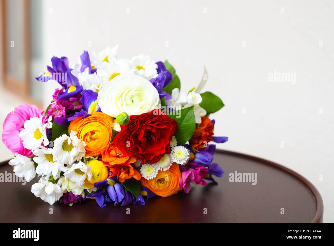 Unusual bright wedding bouquet with ranunculus Stock Photo - Alamy
