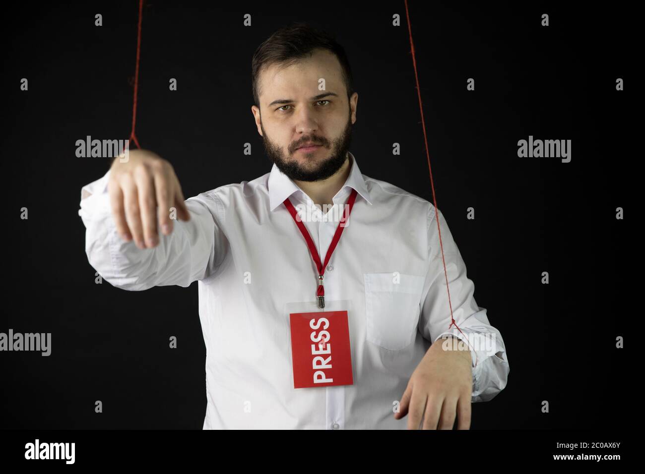 Sad journalist with badge press holds hands tied with ropes like ...