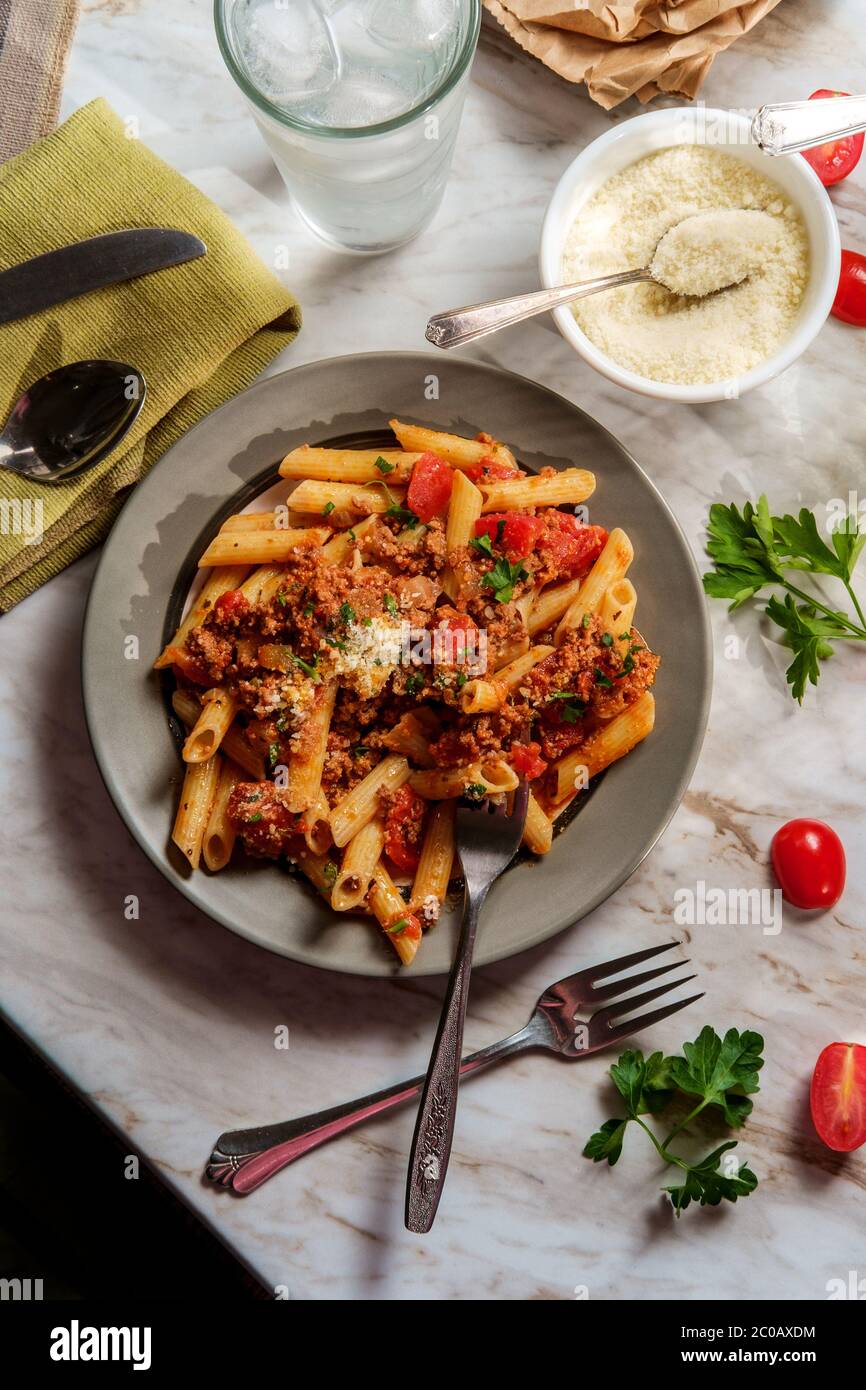 Authentic Italian dinner penne ragu alla bolognese Stock Photo - Alamy
