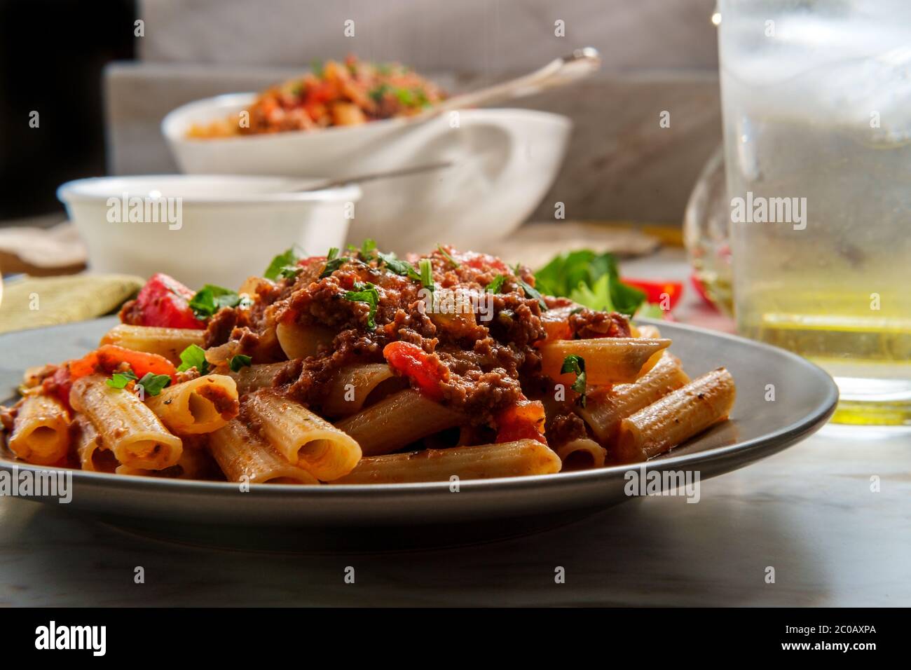 Authentic Italian dinner penne ragu alla bolognese Stock Photo - Alamy