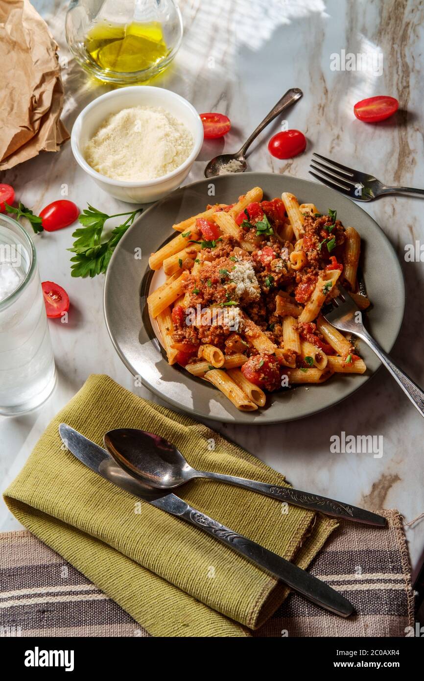 Authentic Italian dinner penne ragu alla bolognese Stock Photo - Alamy
