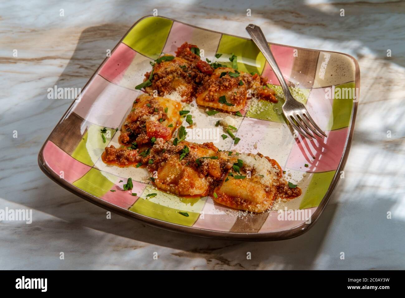Authentic Italian dinner ravioli ragu alla bolognese Stock Photo - Alamy