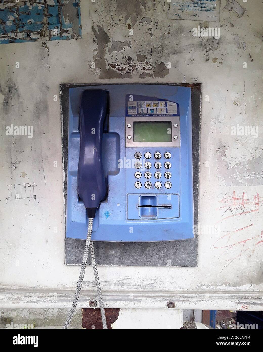 Image of an old and scratched vintage public payphone.Blue old payphone ...