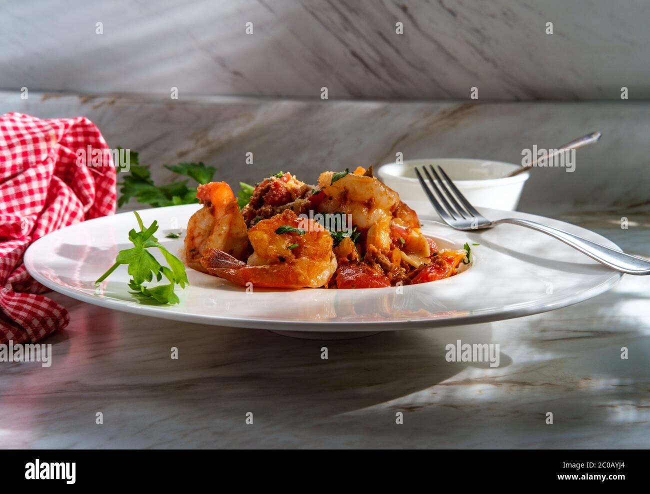 Authentic Italian dinner penne ragu alla bolognese with tail-on shrimp ...