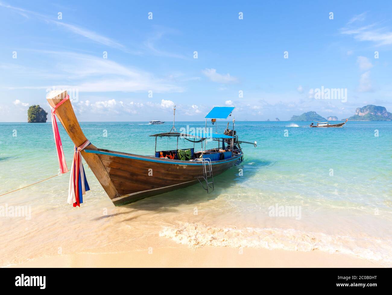 Tropical beach and boat Stock Photo - Alamy