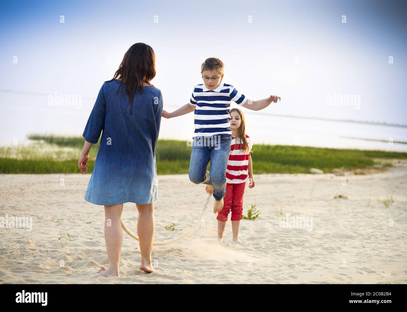 Family tug war beach hi-res stock photography and images - Alamy