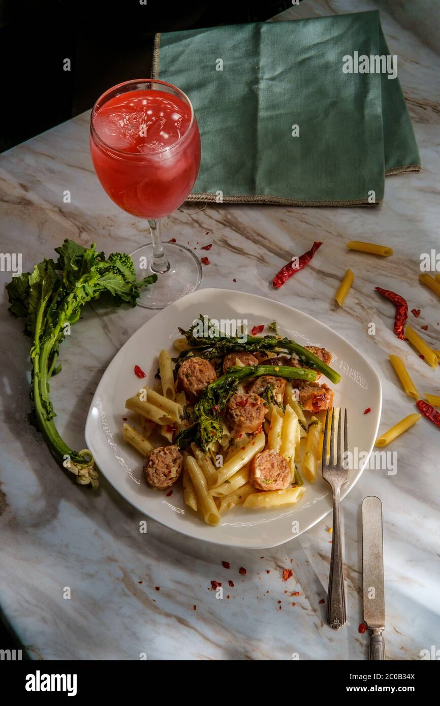 Italian spicy sausage penne pasta and broccoli rabe with dramatic ...