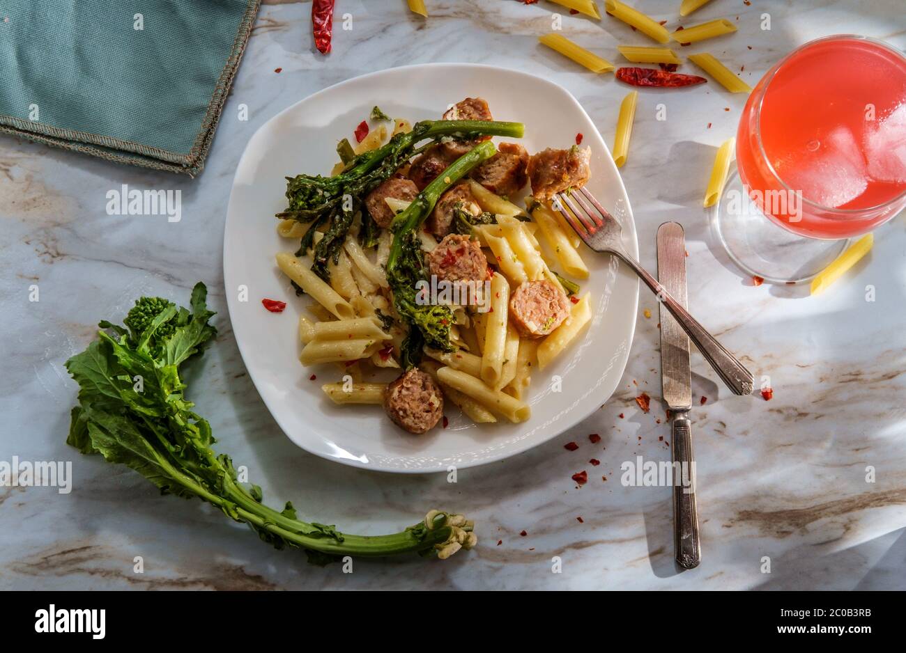Italian spicy sausage penne pasta and broccoli rabe with dramatic ...