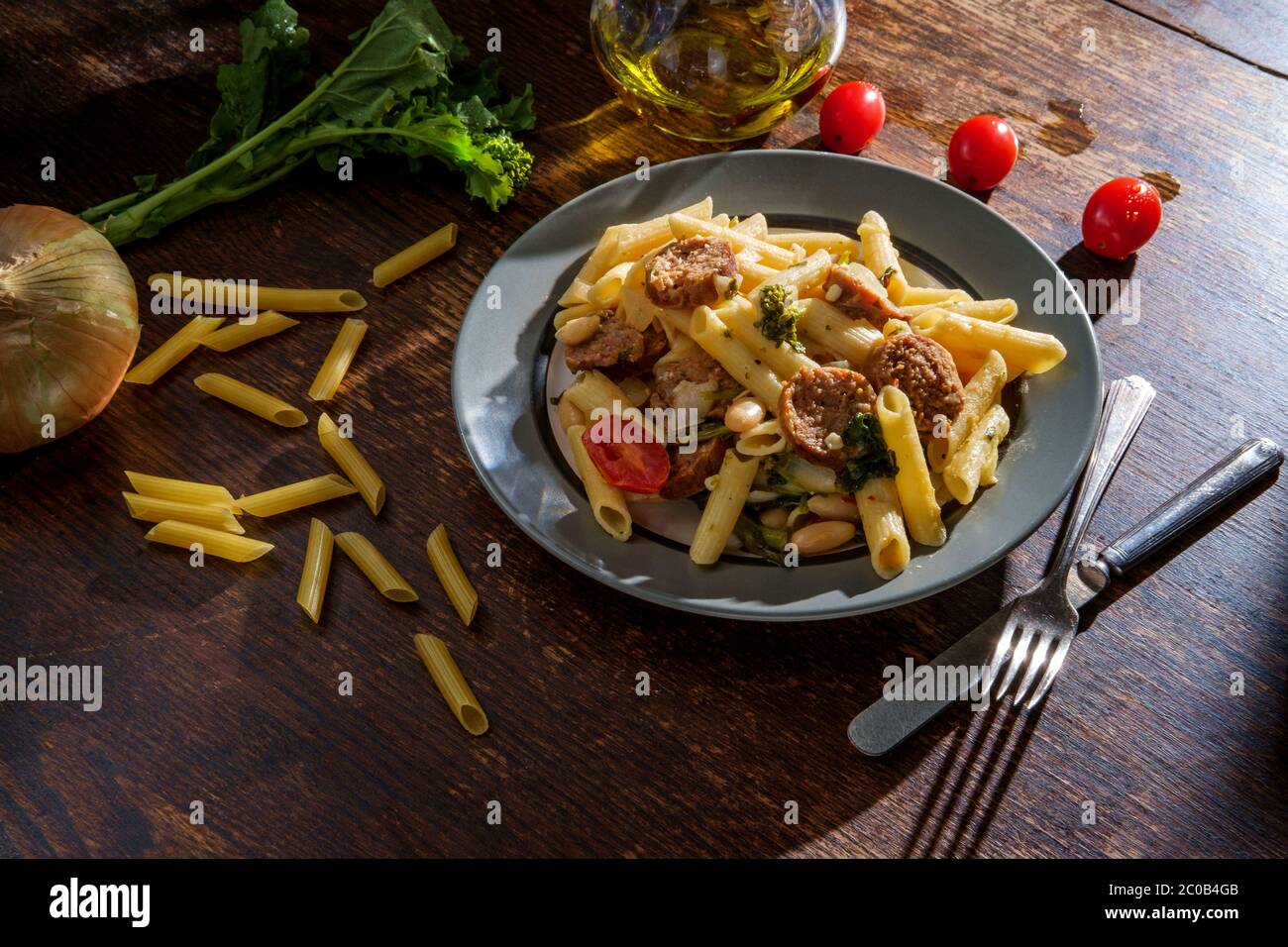 Italian spicy sausage penne pasta and broccoli rabe with dramatic ...