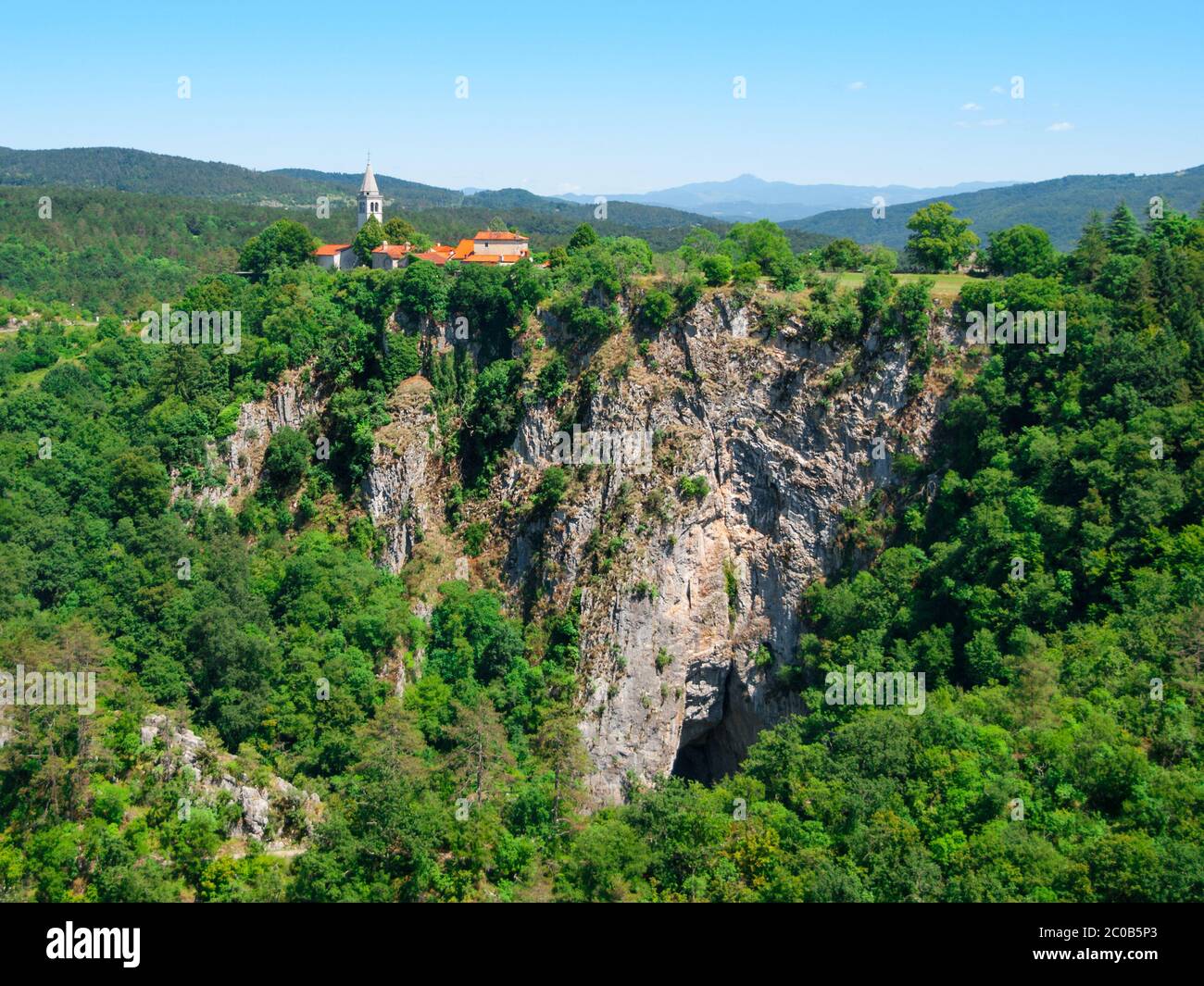 View of deep gorge of Reka River and village with rural church ,Skocjan ...