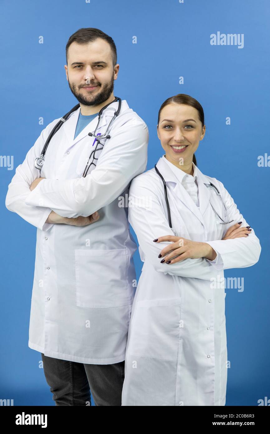 Two confident doctors smiling camera hi-res stock photography and ...