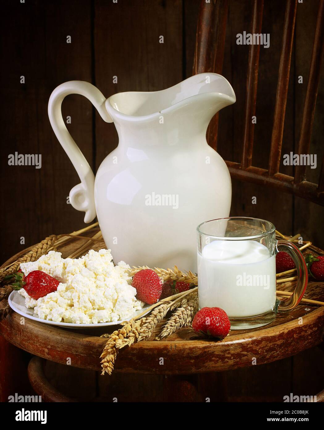 Light morning meal from cottage cheese with a strawberry and milk Stock ...