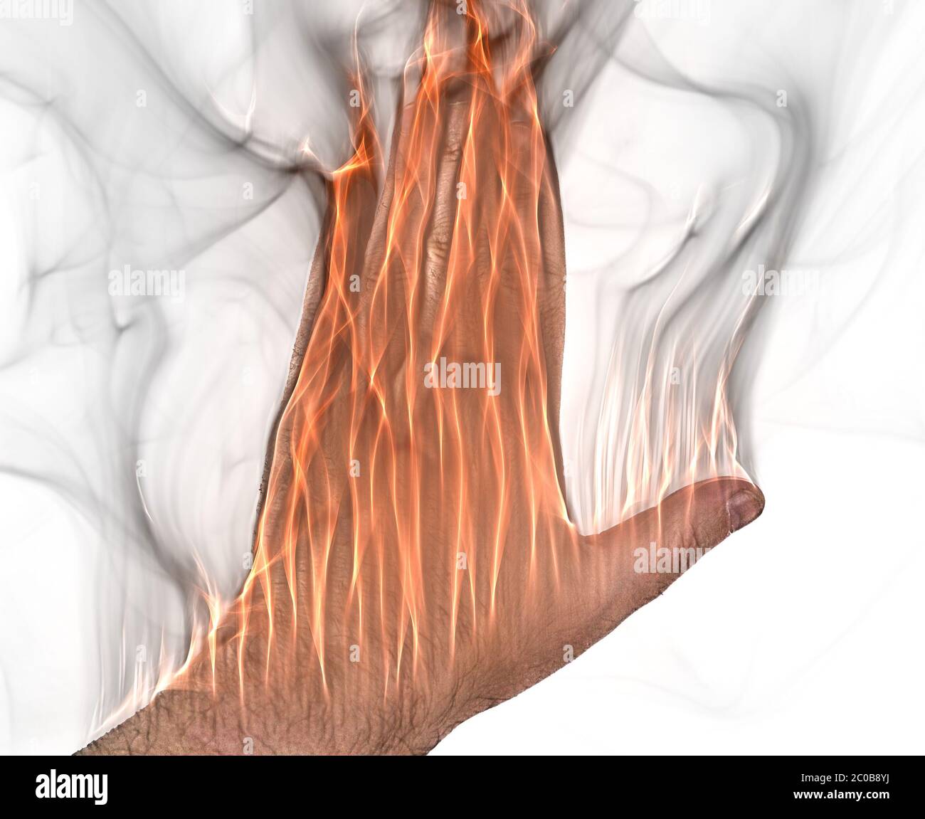 A human hand on fire burning with orange flames and some smoke in front ...