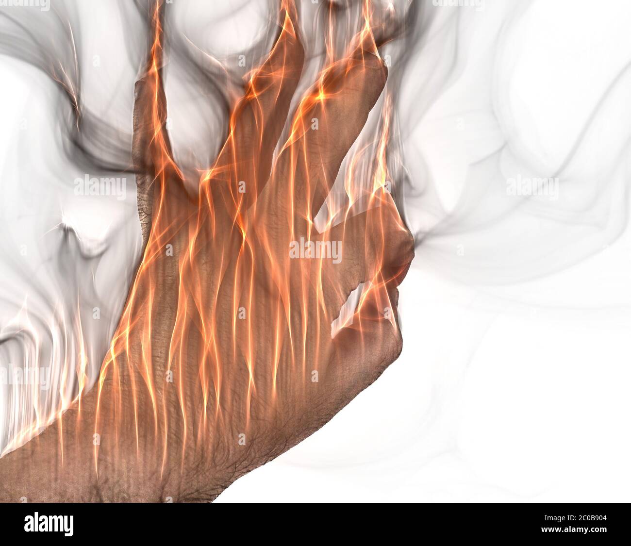 A human hand on fire burning with orange flames and some smoke in front ...