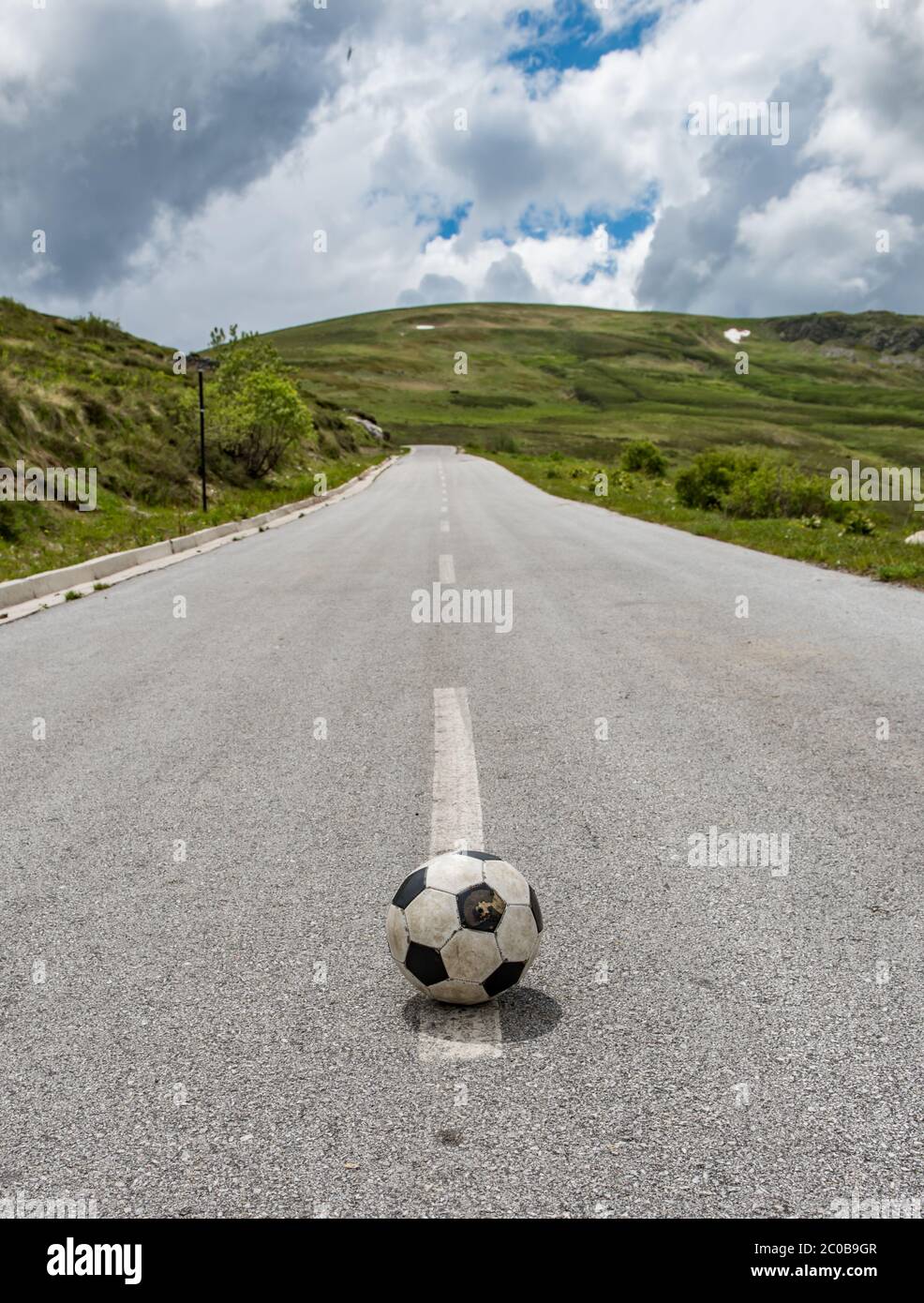 Ball on the road Stock Photo - Alamy