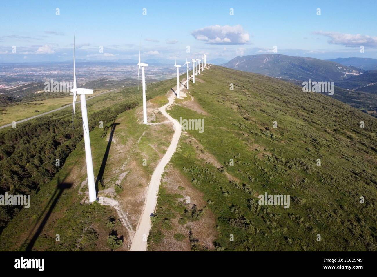 Aerial view of windmills farm for renewable energy production on ...
