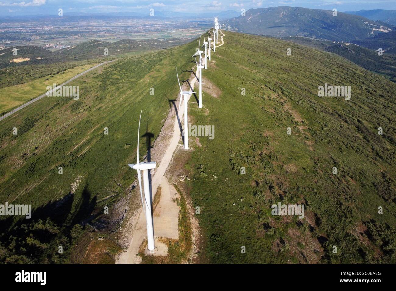 Aerial view of windmills farm for renewable energy production on ...