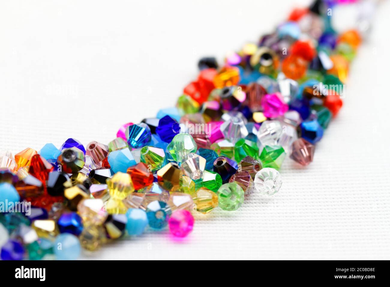 Beautiful glass beads closeup on white background Stock Photo - Alamy