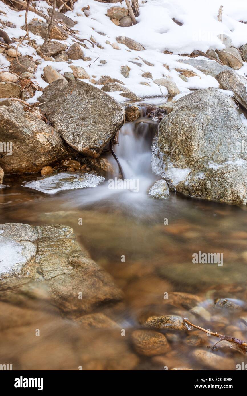 Miniature Waterfall In A Stream With Clear Water Stock Photo - Alamy