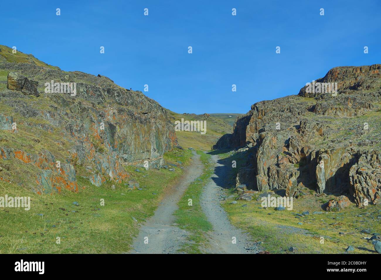 mountain road between the rocks Stock Photo - Alamy
