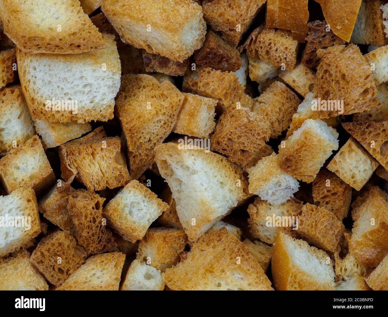 Selective focus on slices of fried white bread close-up. Tasty rosy ...