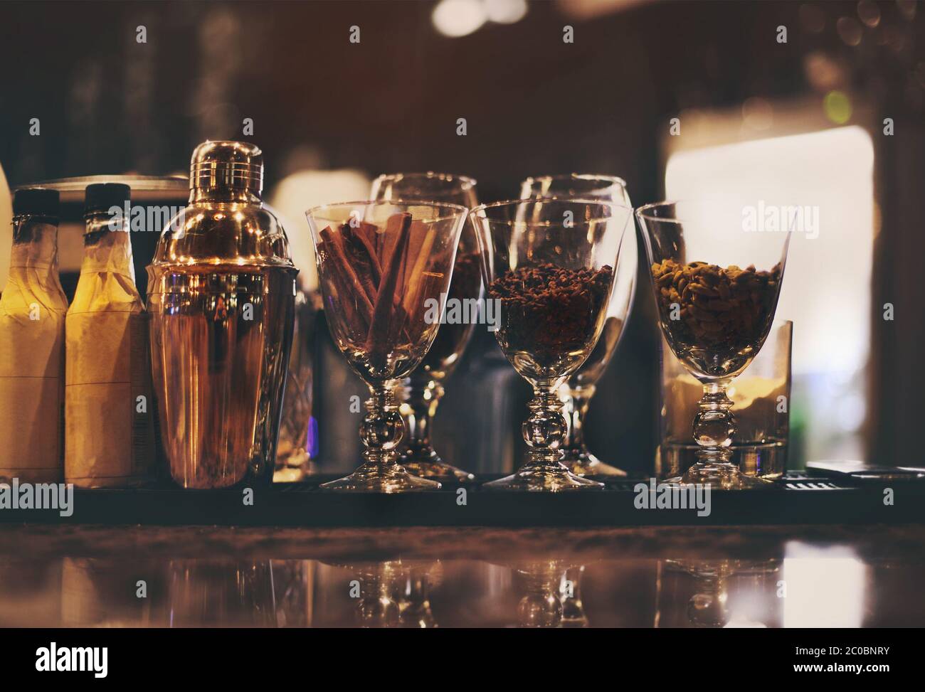 Classic bar counter with bottles in background Stock Photo - Alamy