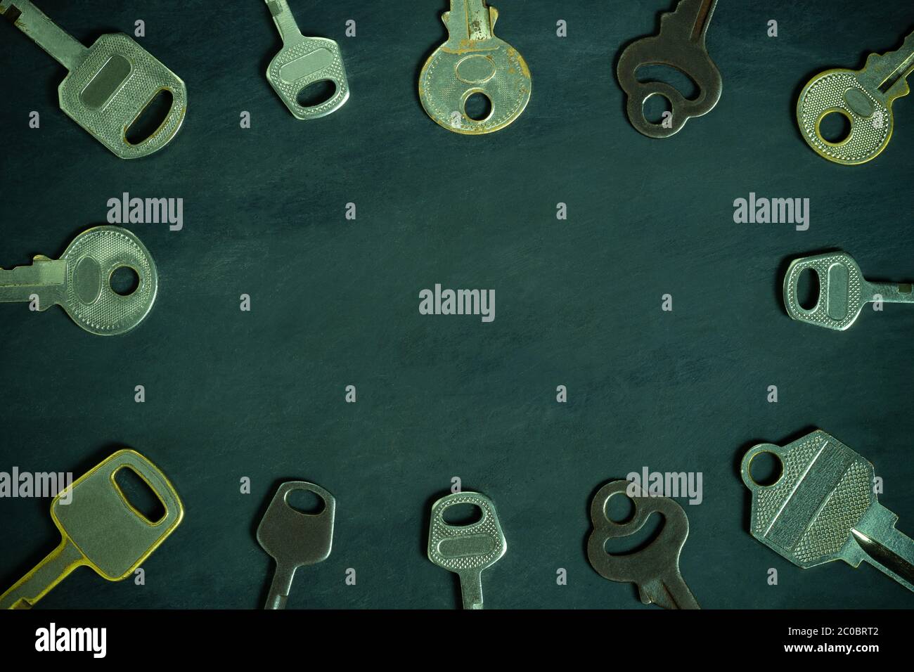 Different variety of vintage keys placed around in circular pattern on ...