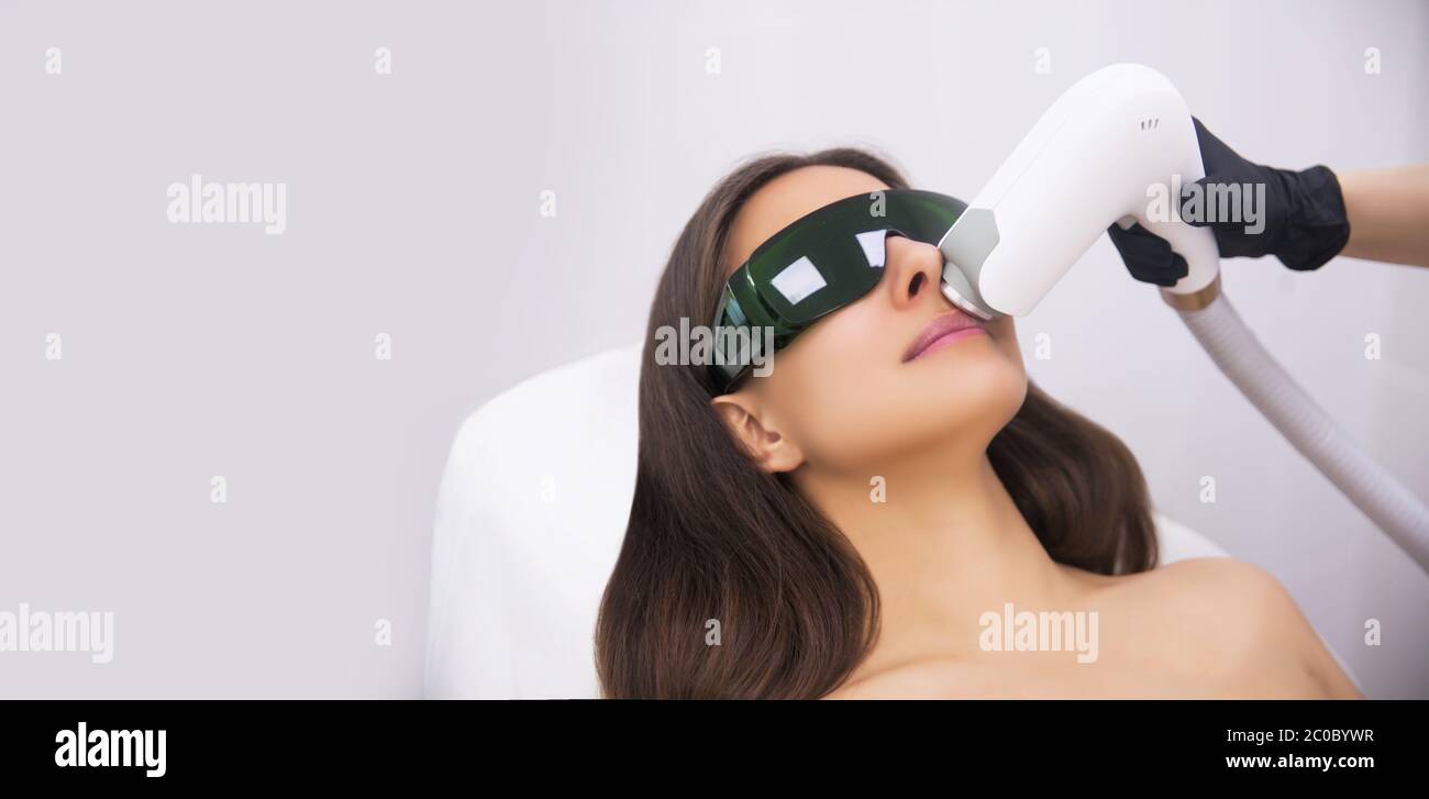 Anti-aging procedures. Skin care concept. Woman receiving facial beauty ...