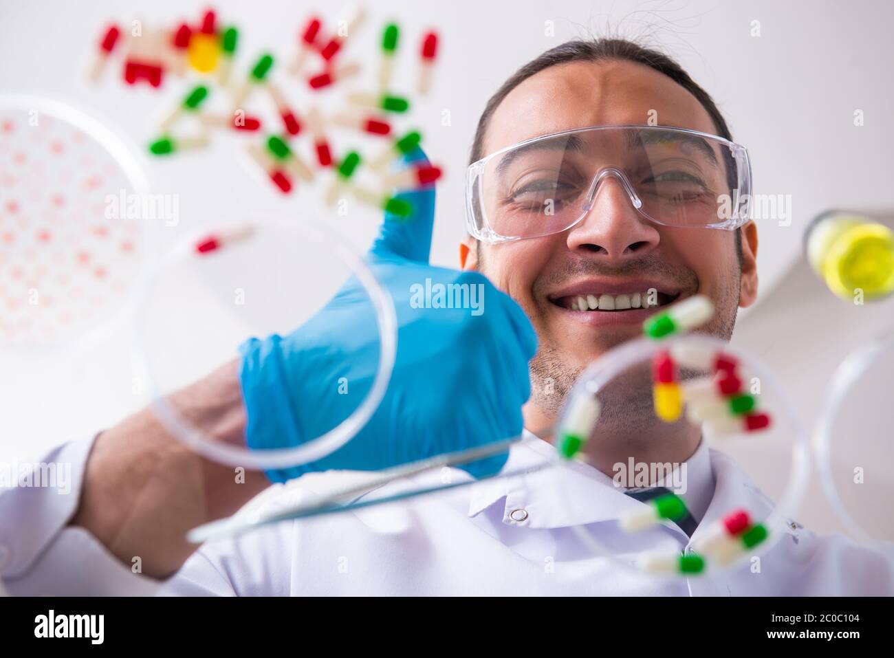 Young pharmacist working in the lab Stock Photo - Alamy