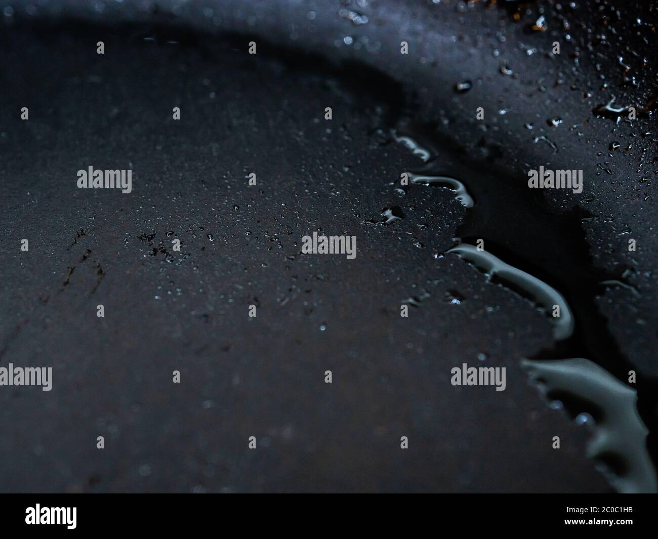 Selective focus on drops of hot oil on the surface of the pan. Abstract ...