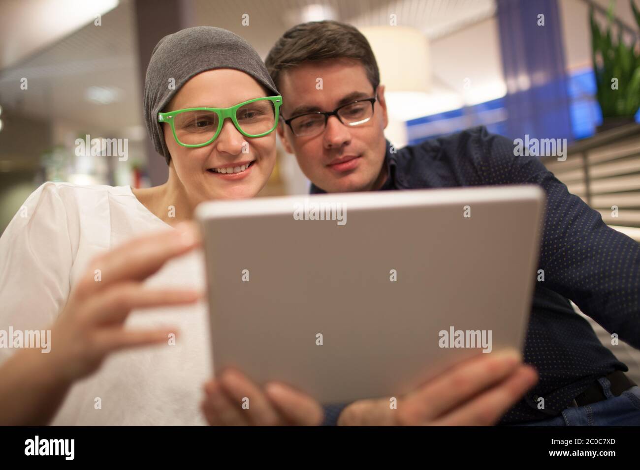 Woman in glasses talking tablet hi-res stock photography and images - Alamy
