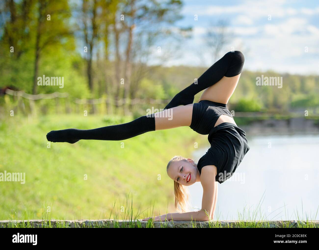 Rhythmic gymnast girl exercising with ribbon outdoor Stock Photo - Alamy