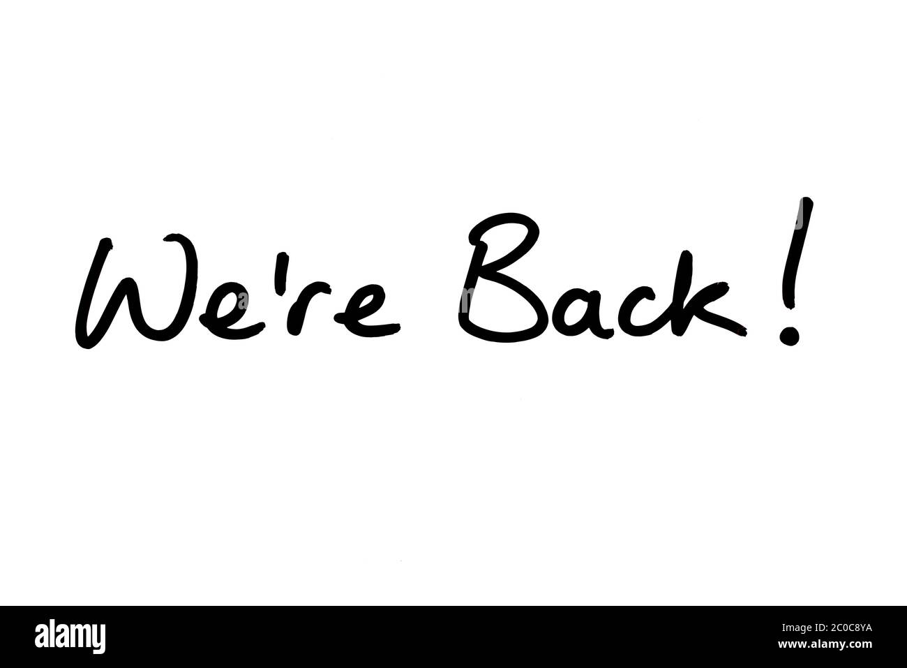 Were Back! handwritten on a white background Stock Photo - Alamy
