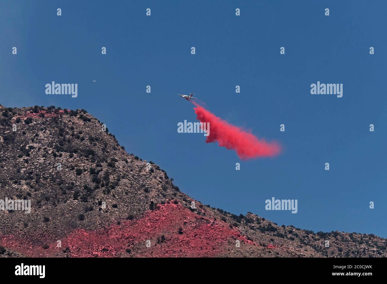 Tucson, Arizona, USA. 11th June, 2020. Firefighters spray fire ...