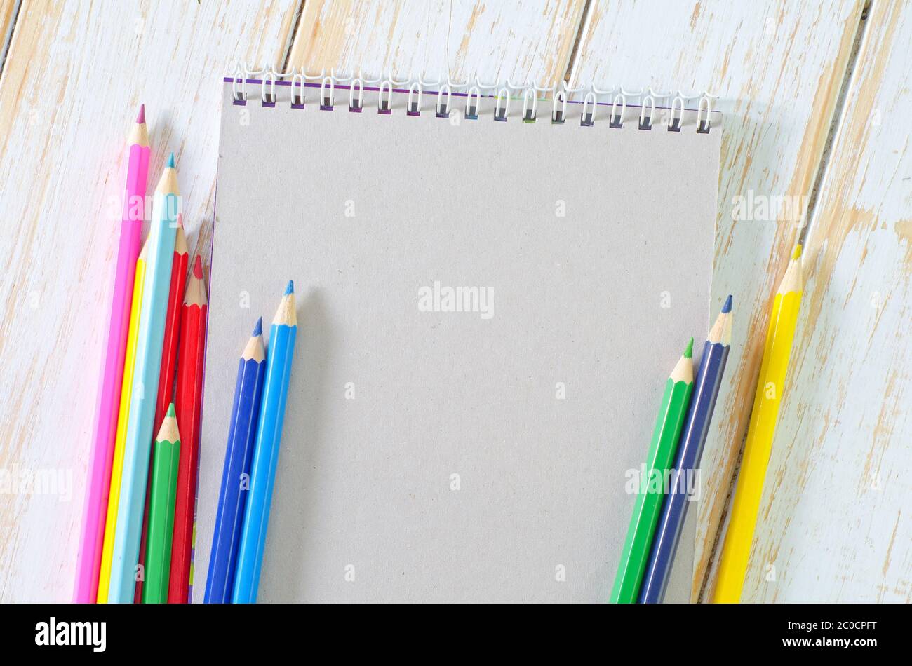 note and pencils Stock Photo - Alamy