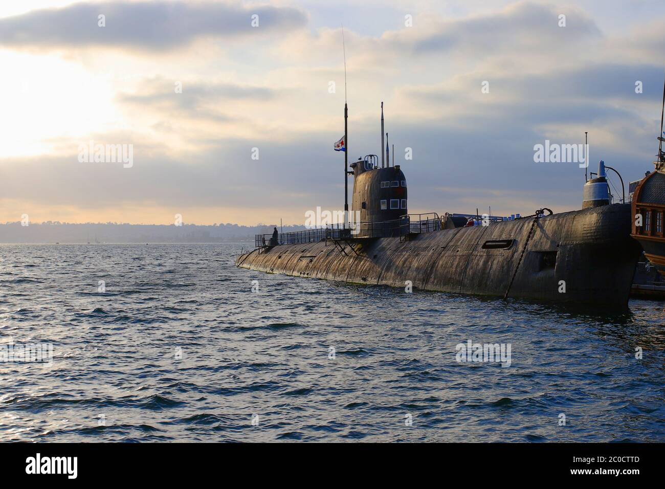 Soviet (red army) Russian submarine anchored to a pier, at sunset Stock ...
