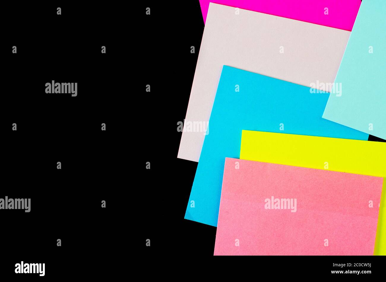 color sheets for note on black background Stock Photo - Alamy
