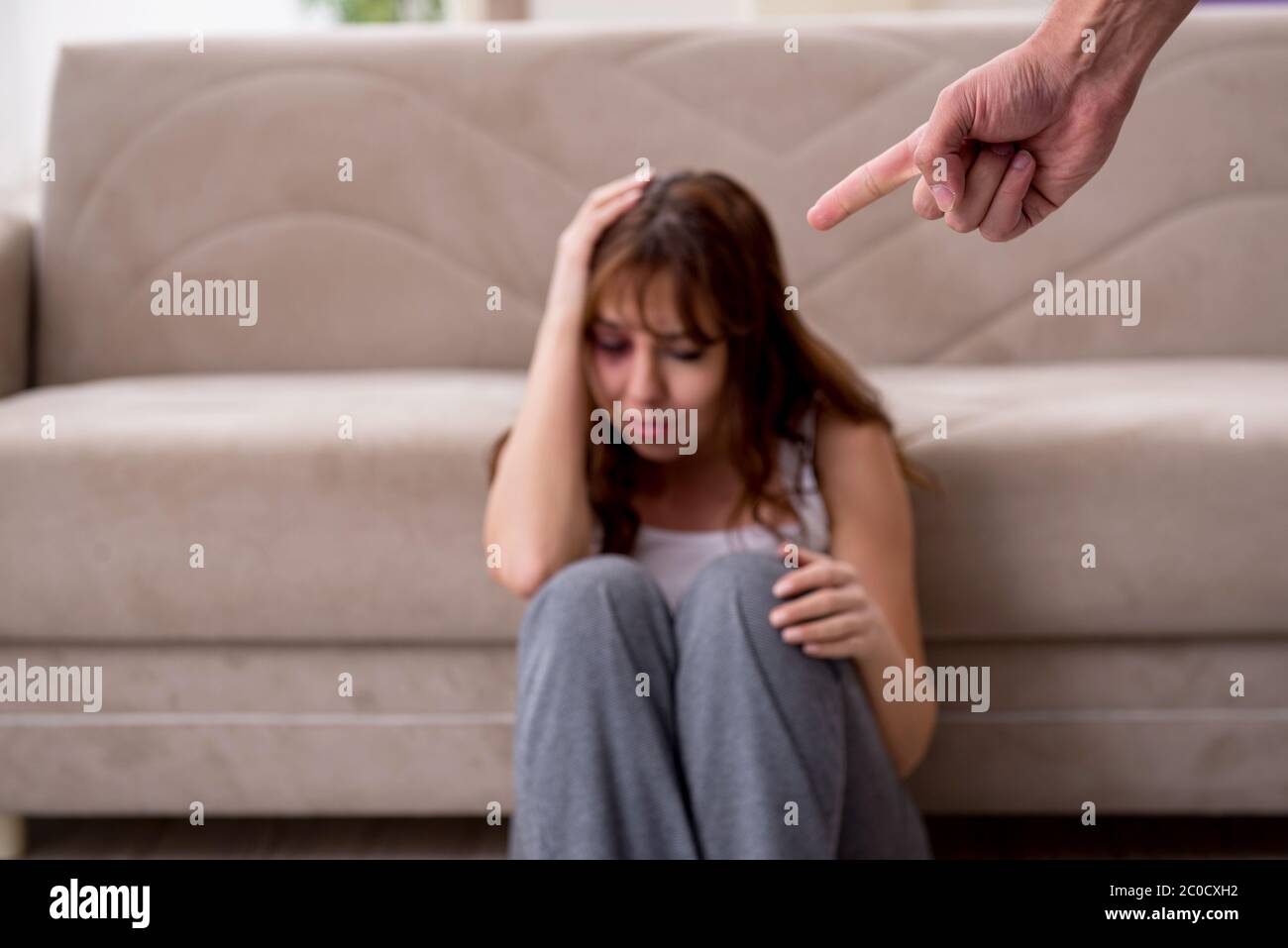 Young couple in the domestic violence concept Stock Photo - Alamy