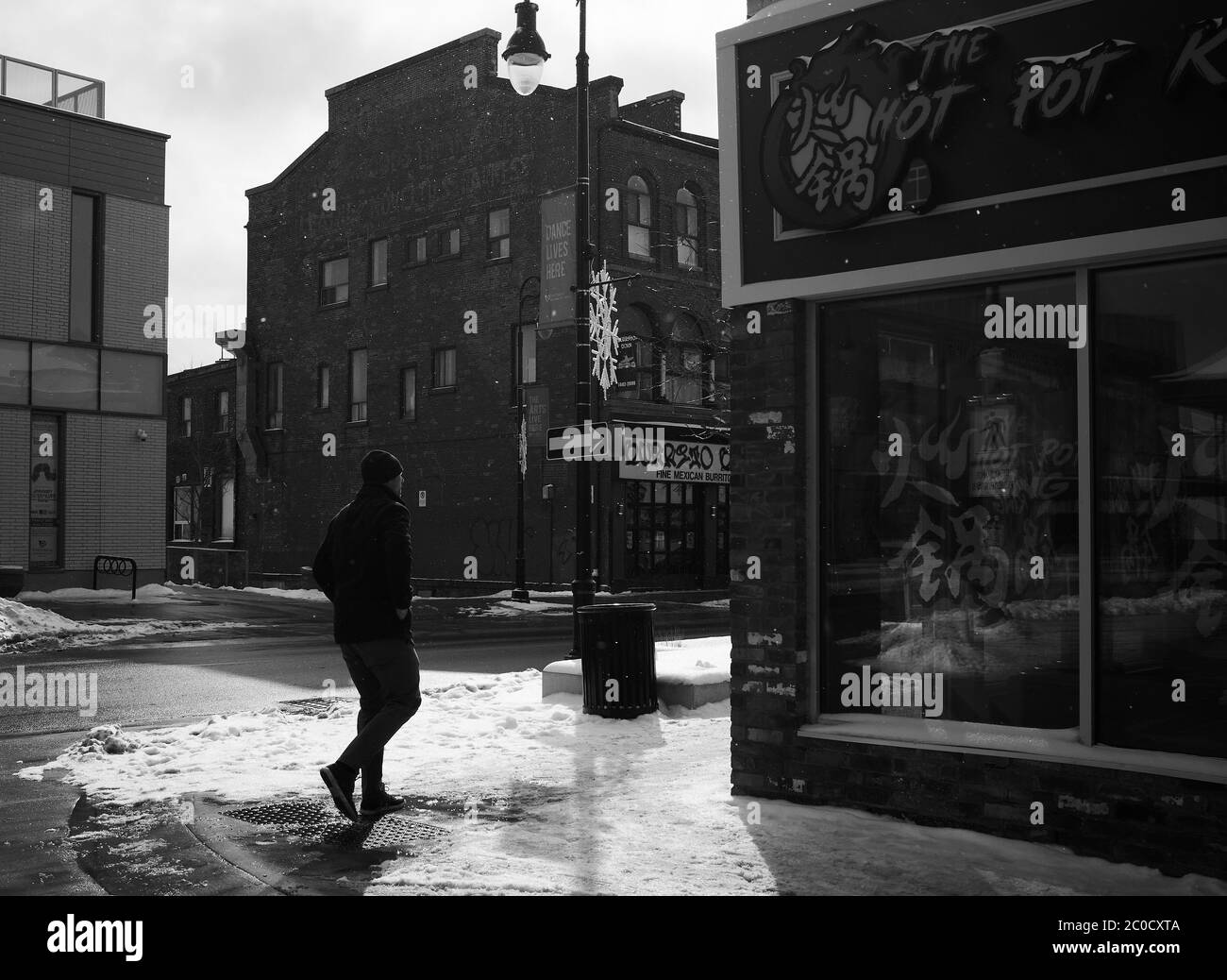 Winter scene man walking black hi-res stock photography and images - Alamy