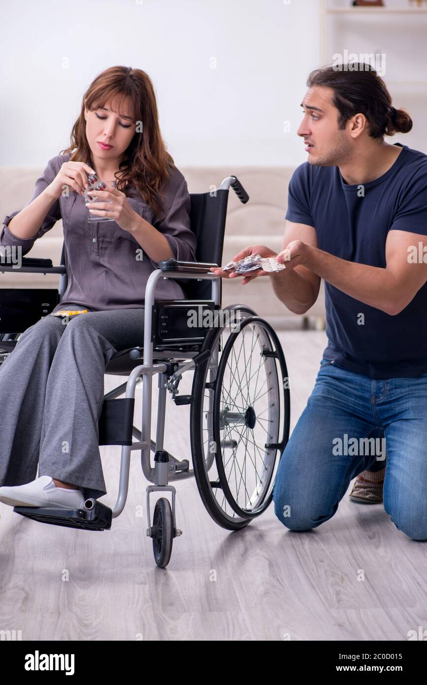 Disabled wife and husband at home Stock Photo - Alamy