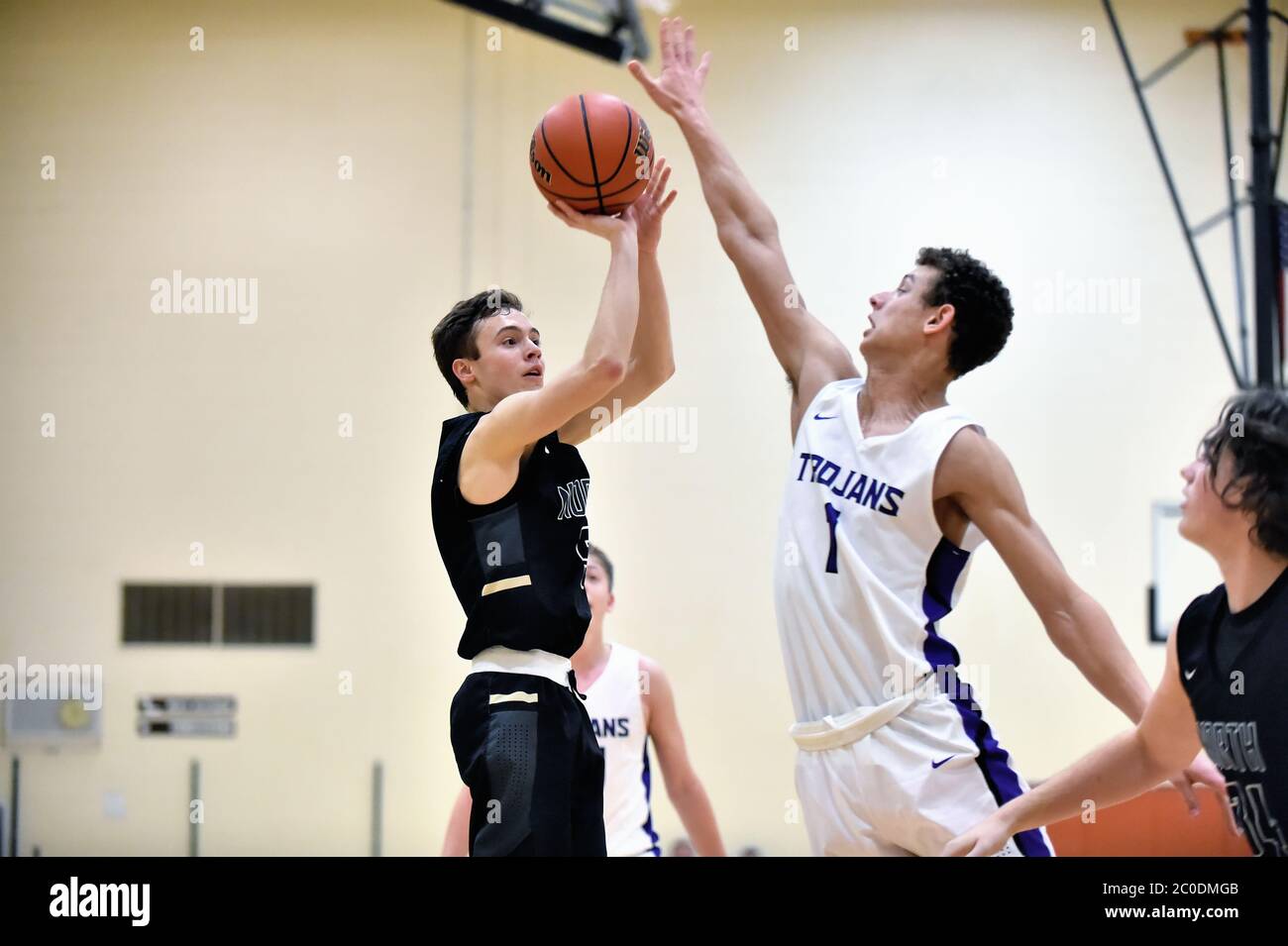 Player taking a jump shot that was blocked by a defending opponent. USA ...