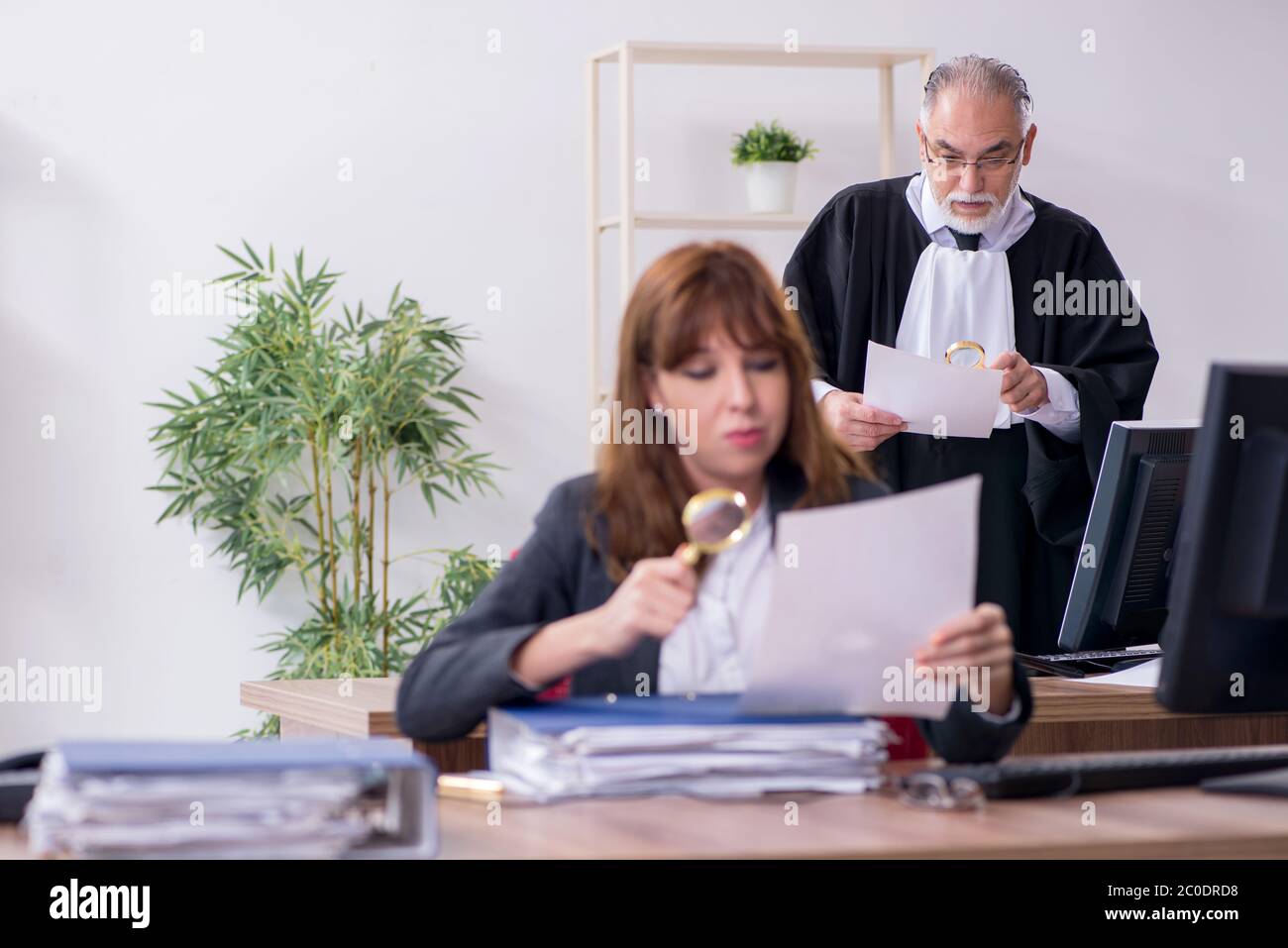 Old judge and his young secretary in the office Stock Photo - Alamy