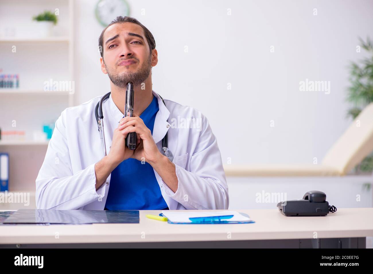 Young doctor being tired after night shift Stock Photo - Alamy