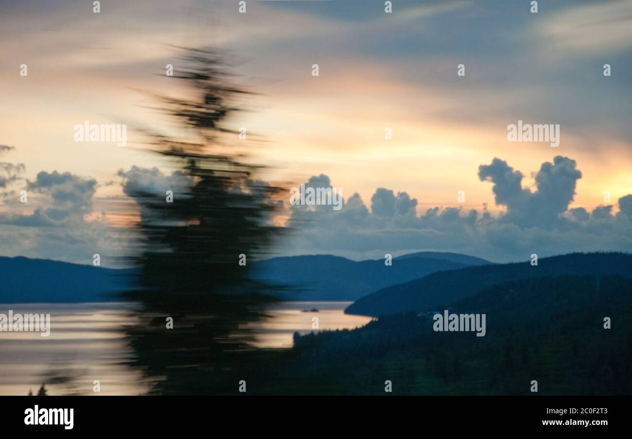 Midnight scenery with lake and clouds Stock Photo - Alamy