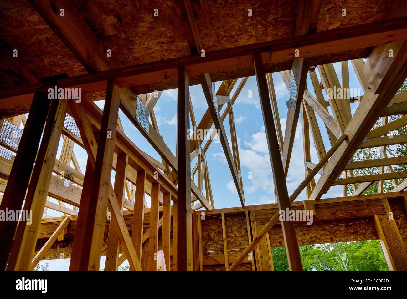 Wooden under construction new residential home beam framing Stock Photo ...
