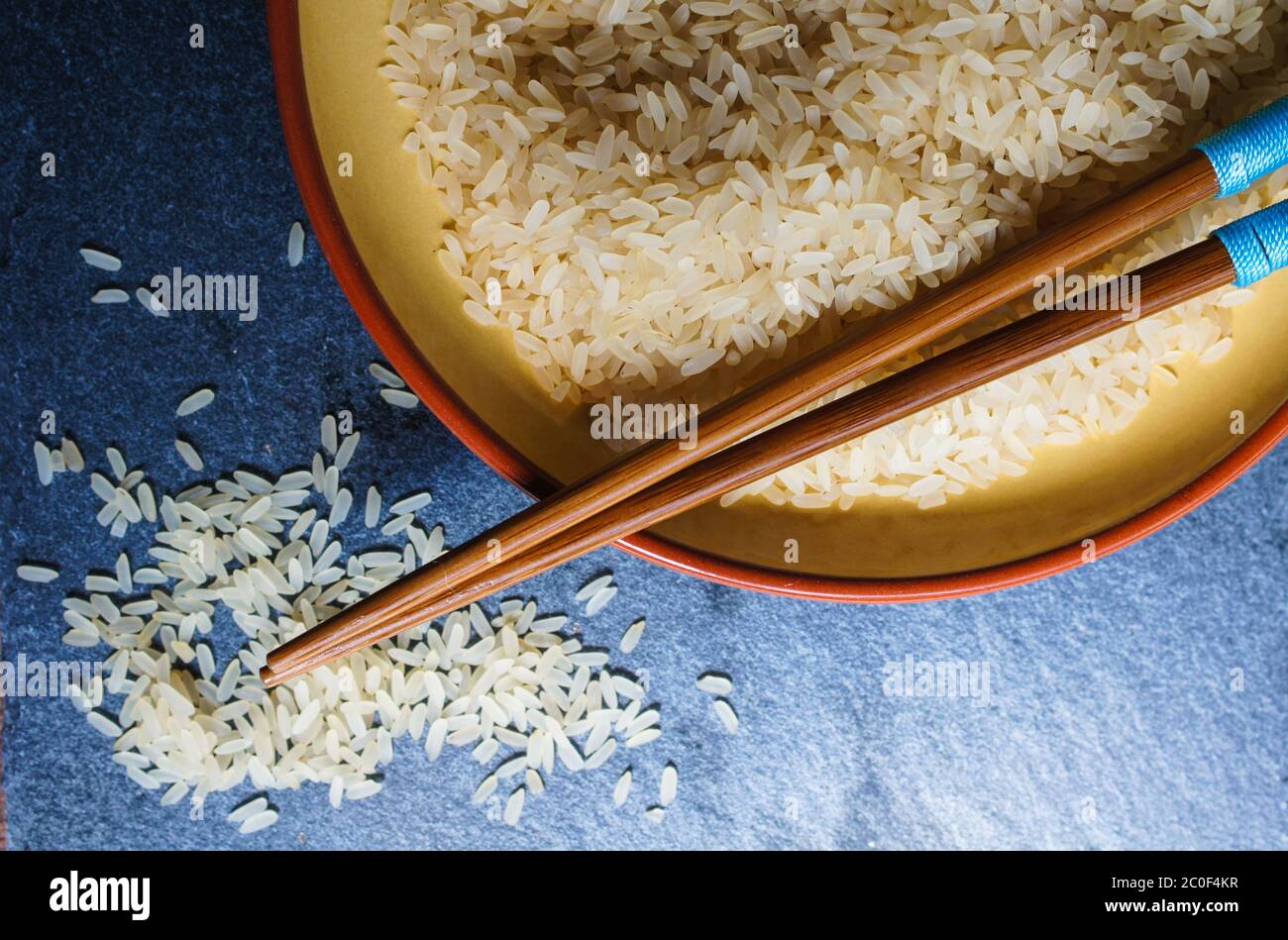 Uncooked rice with chopsticks hi-res stock photography and images - Alamy