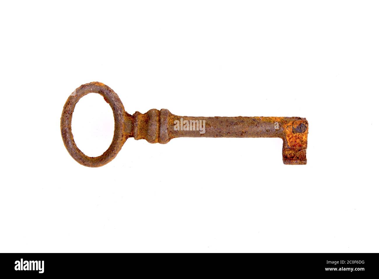 Rusty key on a white background Stock Photo - Alamy